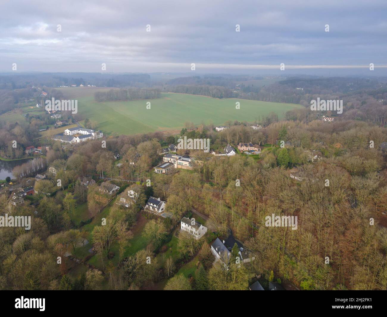 Aerial view of houses surrounded by forest in the country side area of ...