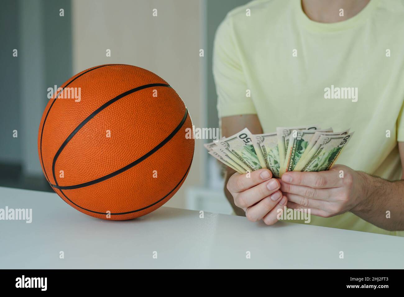 Man holding ball hands hi-res stock photography and images - Alamy