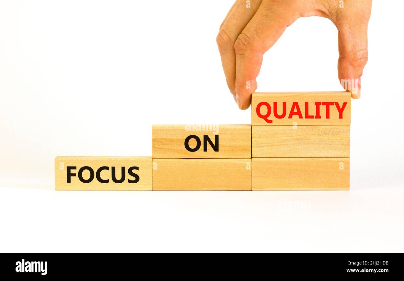 Focus on quality symbol. Concept words Focus on quality on blocks on ...