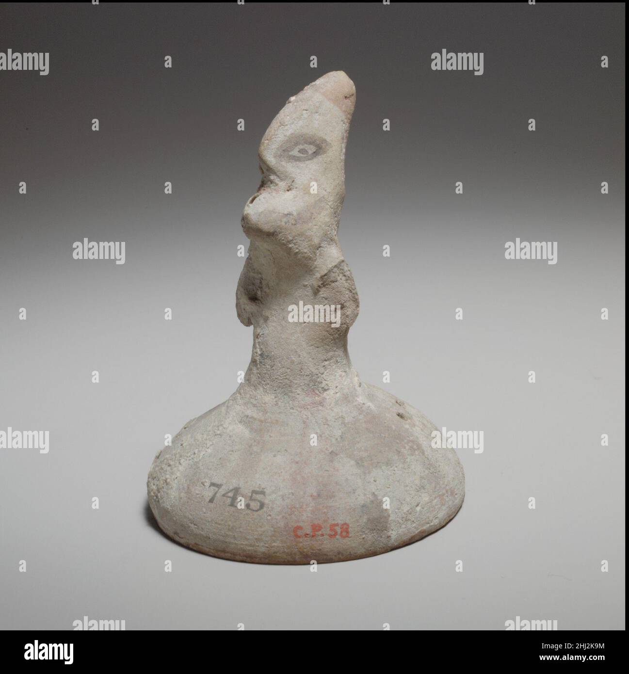 Standing male figurine ca. 750–600 B.C. Cypriot Bell with handle in ...