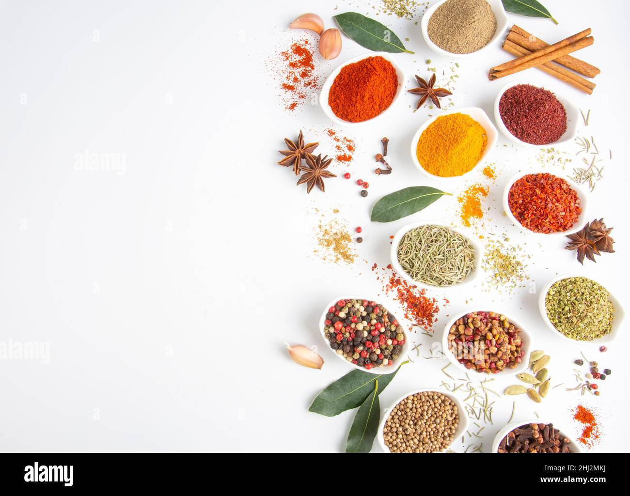 Assorted various spices on white background Stock Photo - Alamy