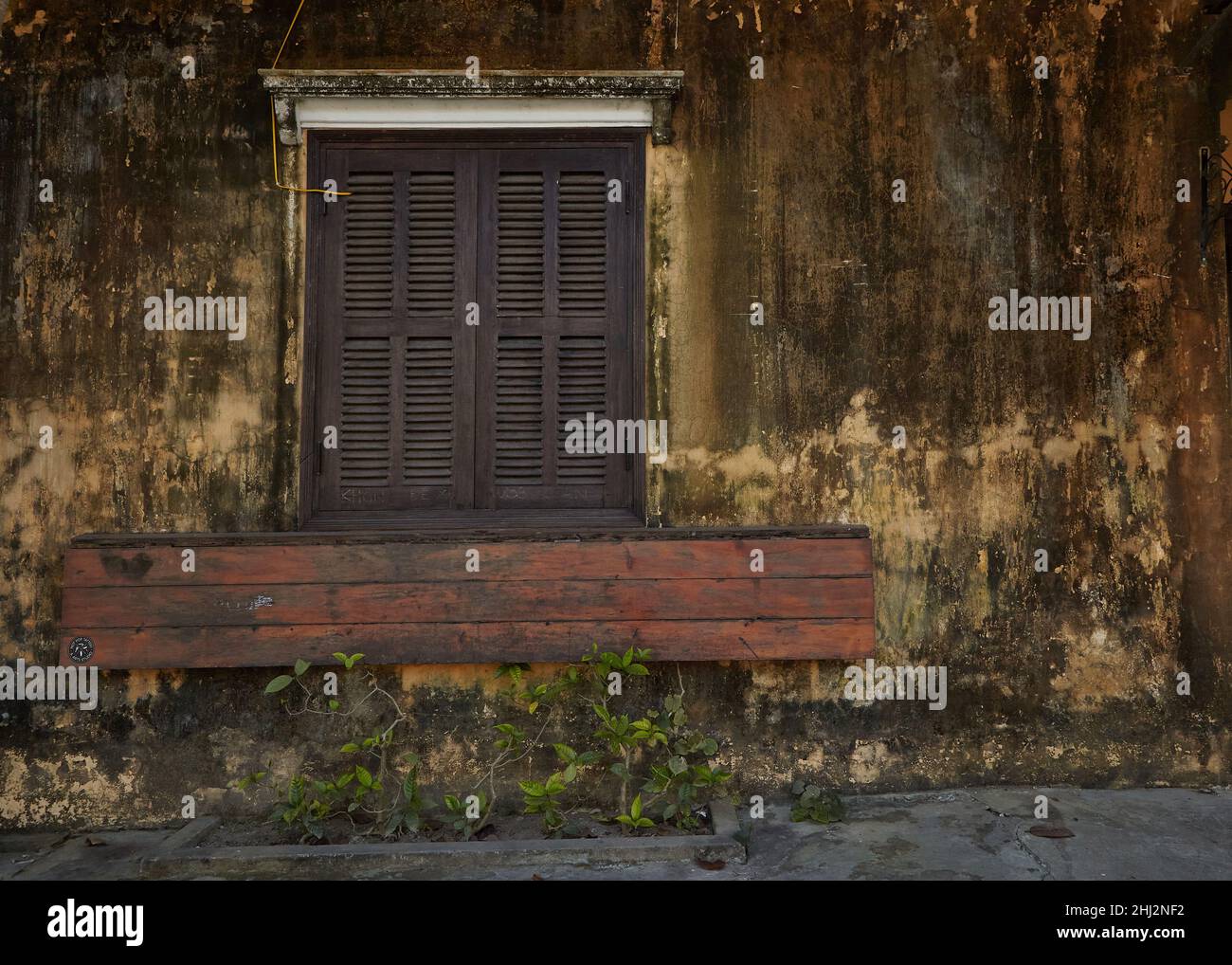 Old brown wall with window shutters in ancient city Hoi An, Vietnam ...