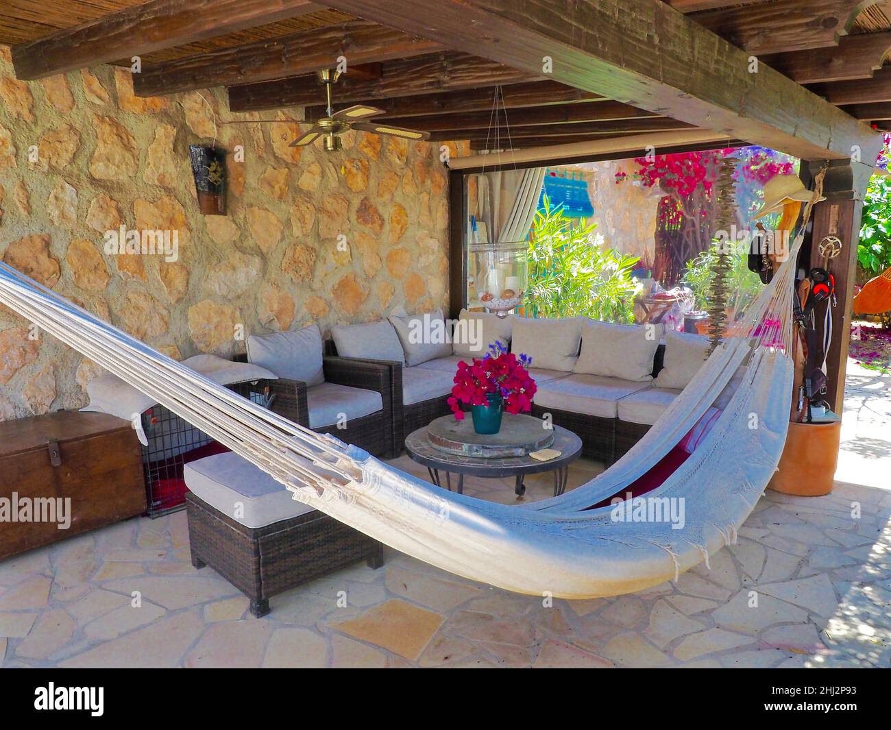 Covered wooden veranda with seating area and hammock, Casa del Aguila ...
