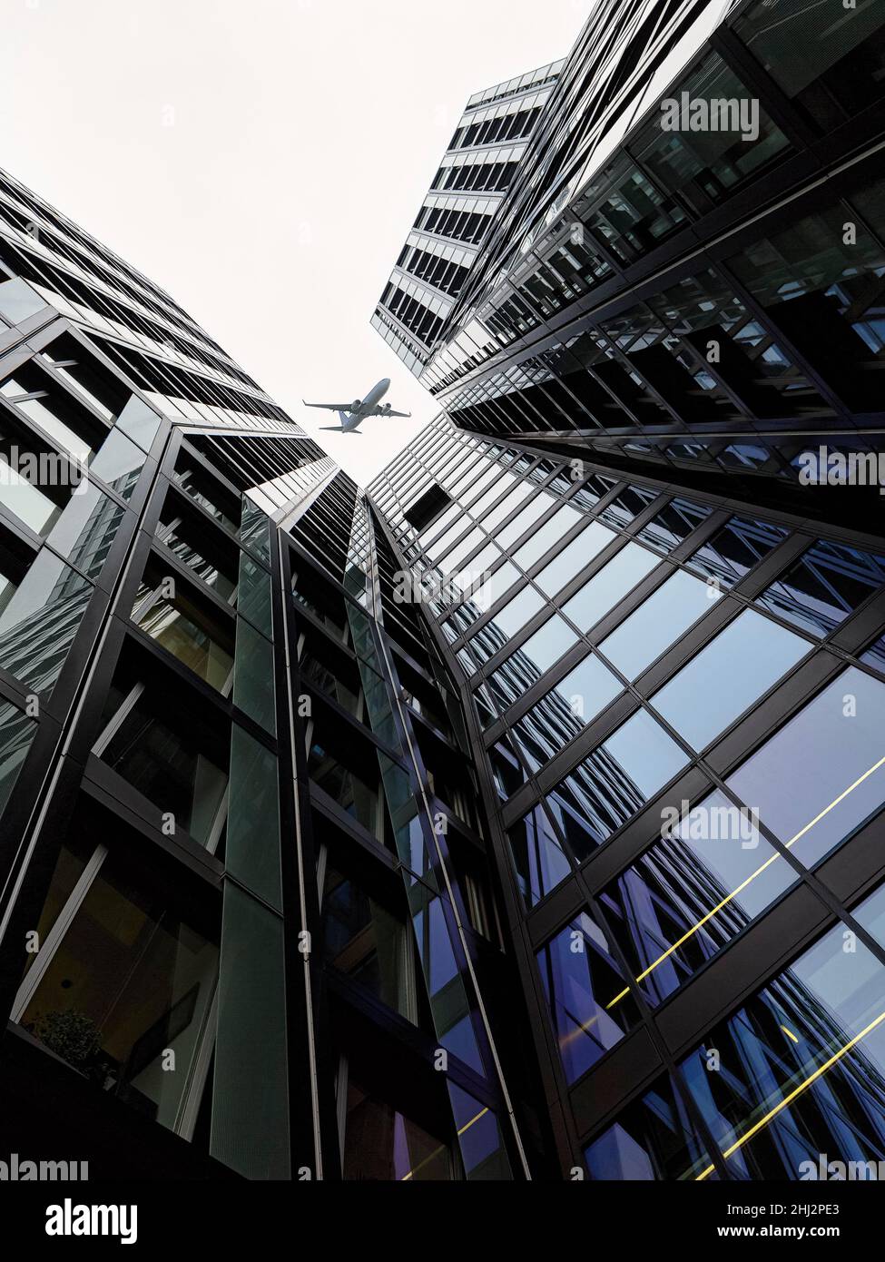 Aeroplane over two skyscrapers, Dancing Towers, facade construction of ...