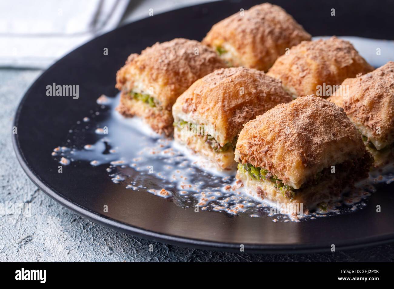 Traditional turkish new dessert cold milky baklava with pistachio ...