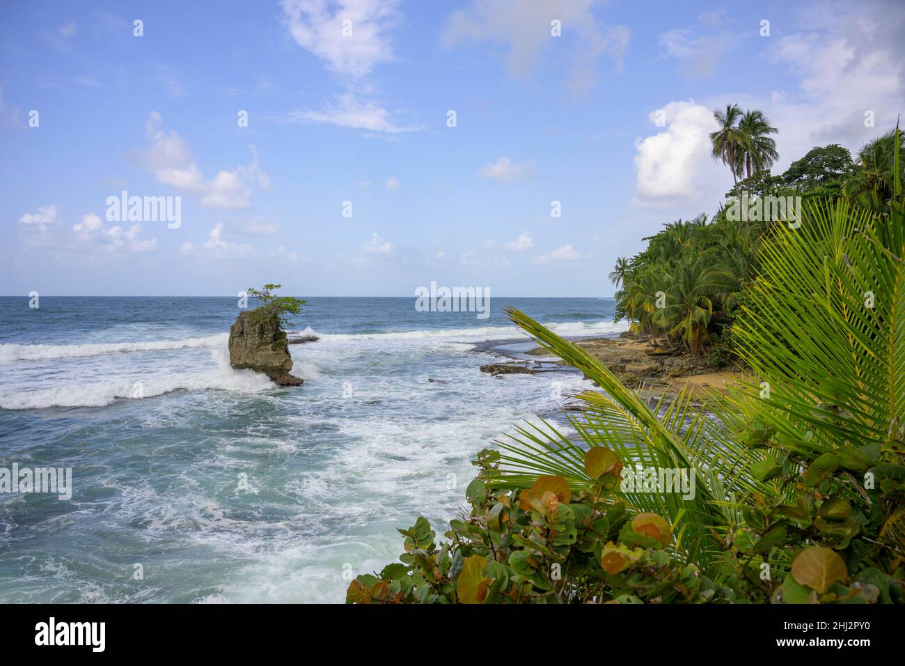 View of rocks in the sea from Mirador Manzanillo, Manzanillo National ...