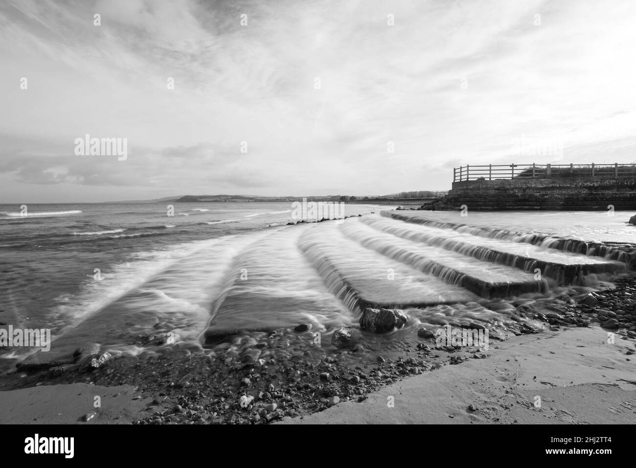 Long exposure of the waterfall from the river Avill flowing onto ...