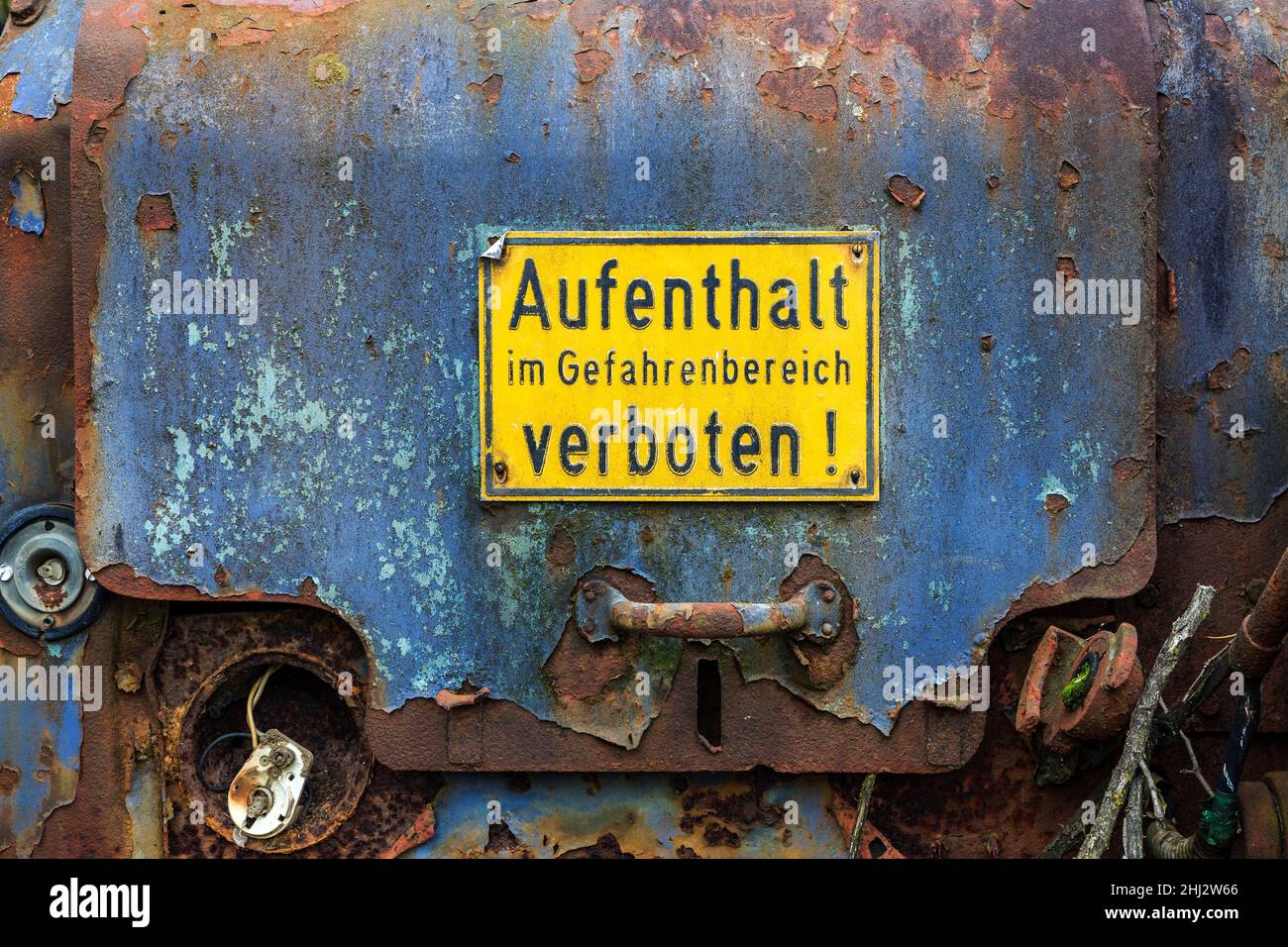 Prohibition sign on old machine door, stay in danger area prohibited ...