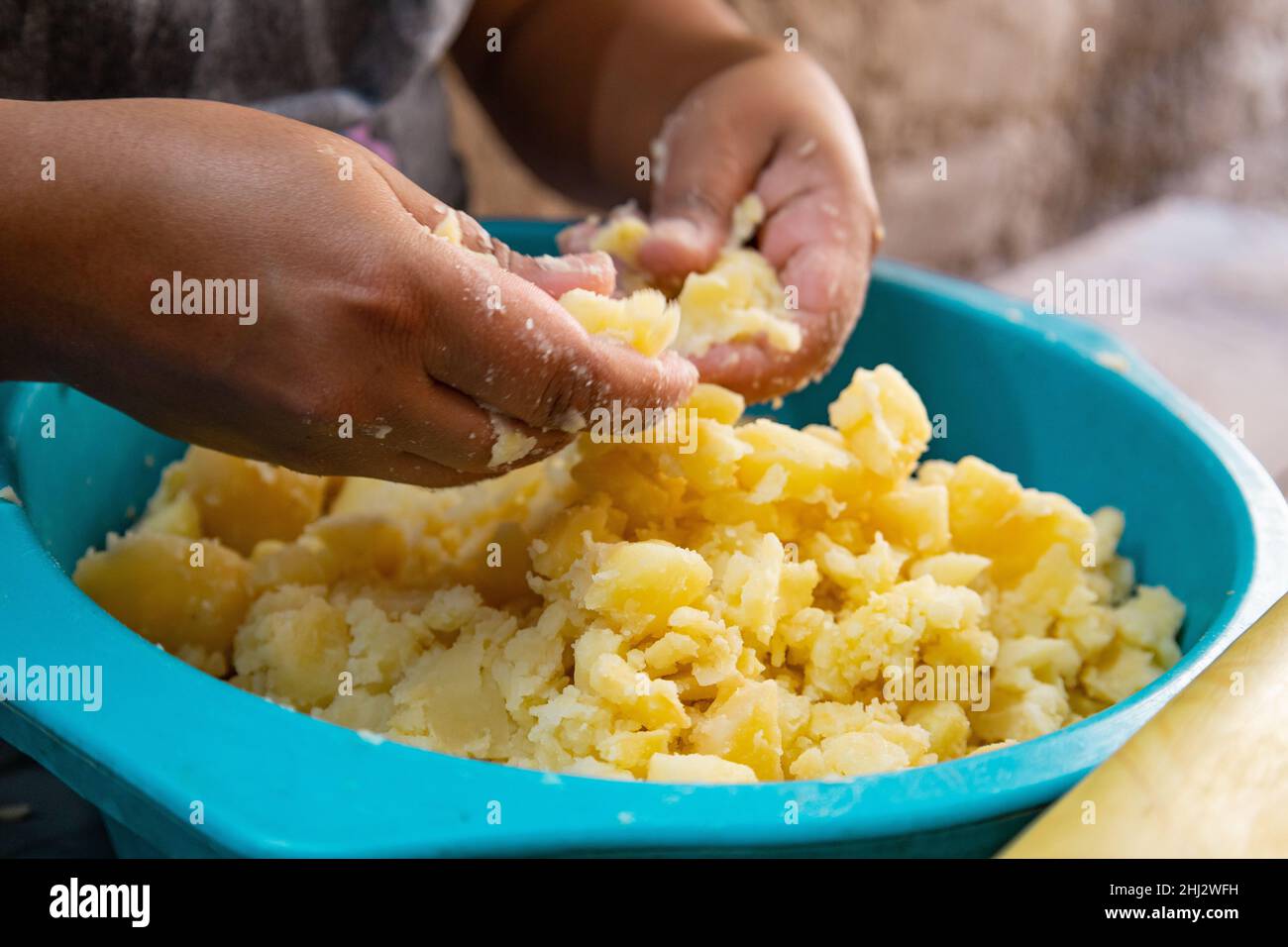 Woman mashing potatoes hi-res stock photography and images - Alamy