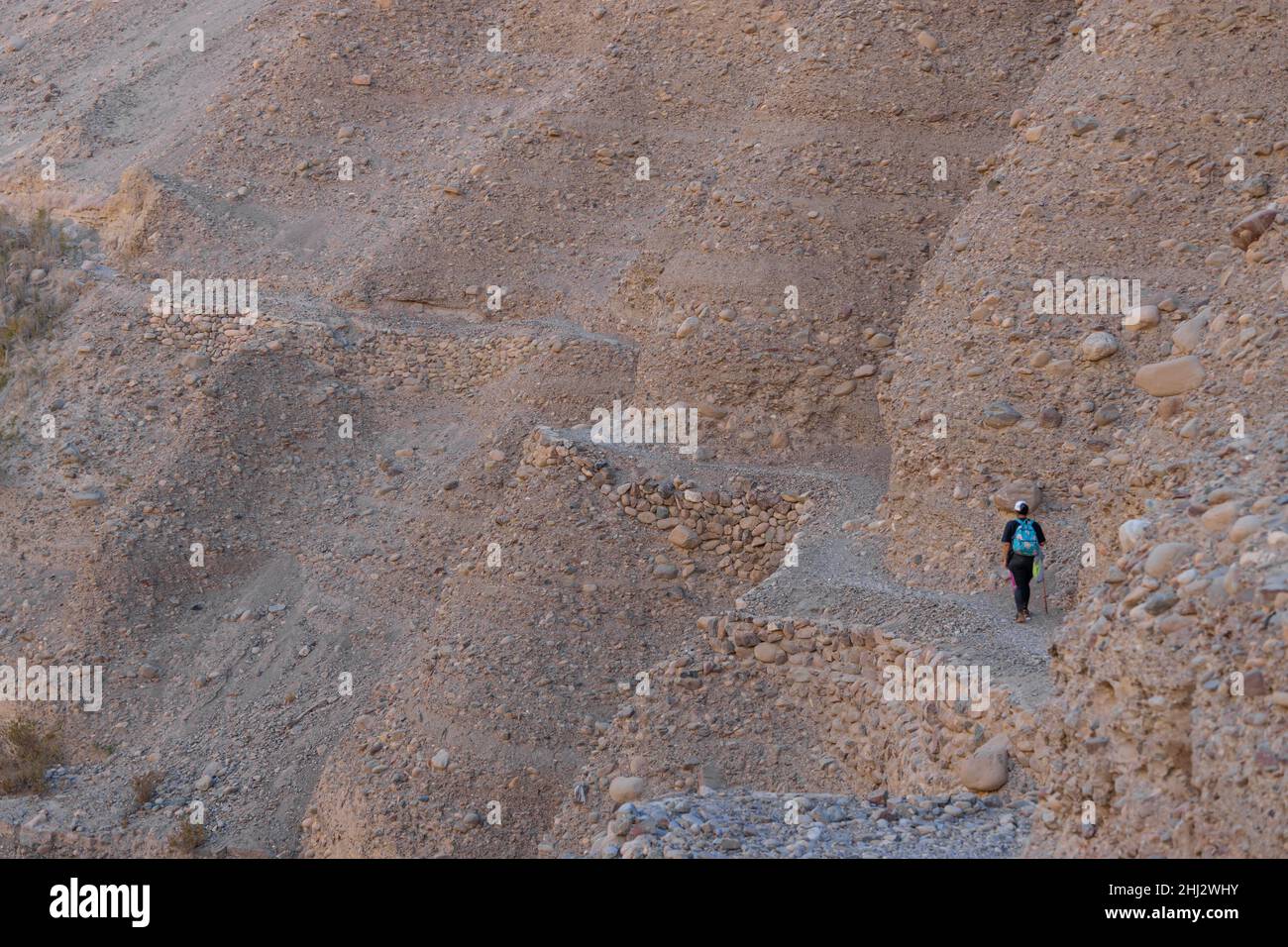 woman walking on a dangerous path in the mountain Stock Photo - Alamy