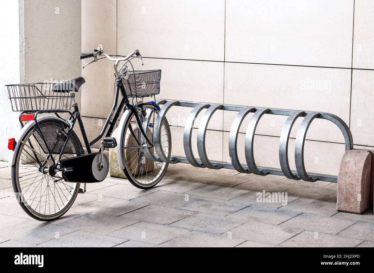 Bicycle ready for use in urban area - Bike rack in city commercial ...