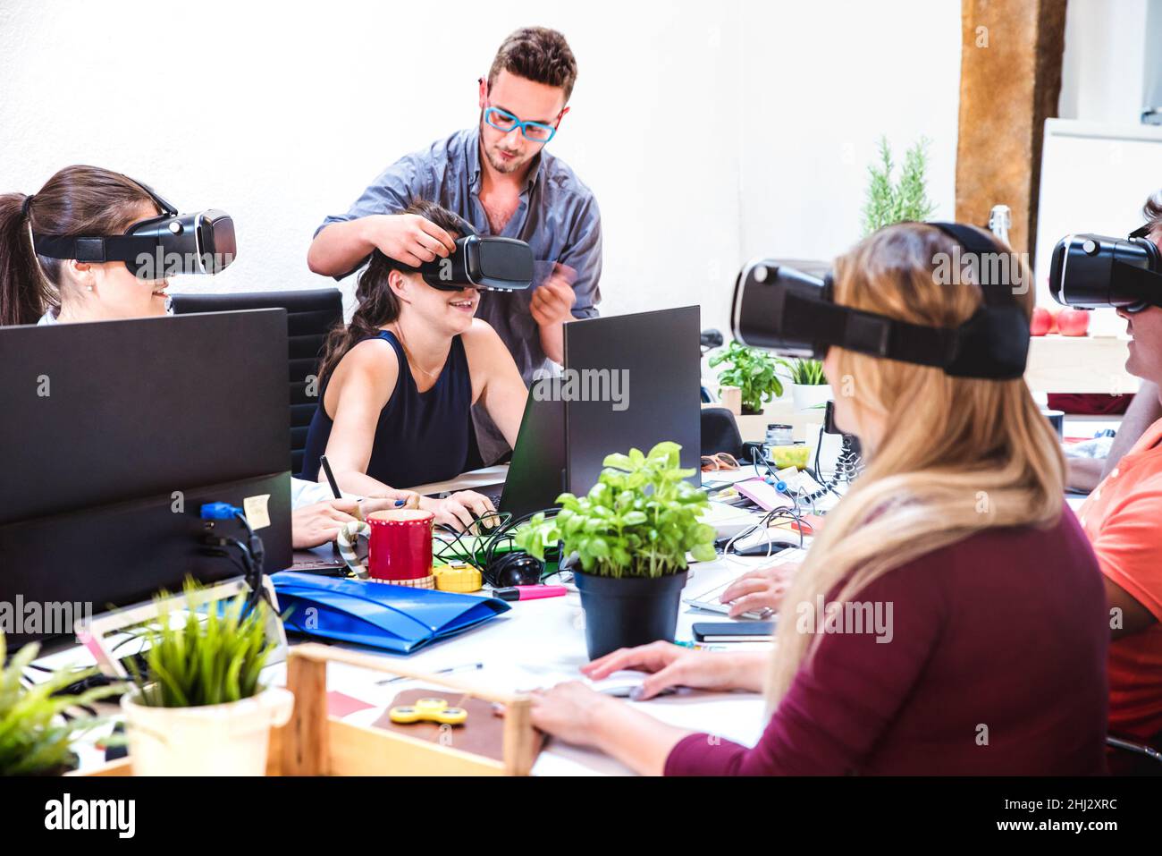 Young people employee workers having fun with vr virtual reality ...