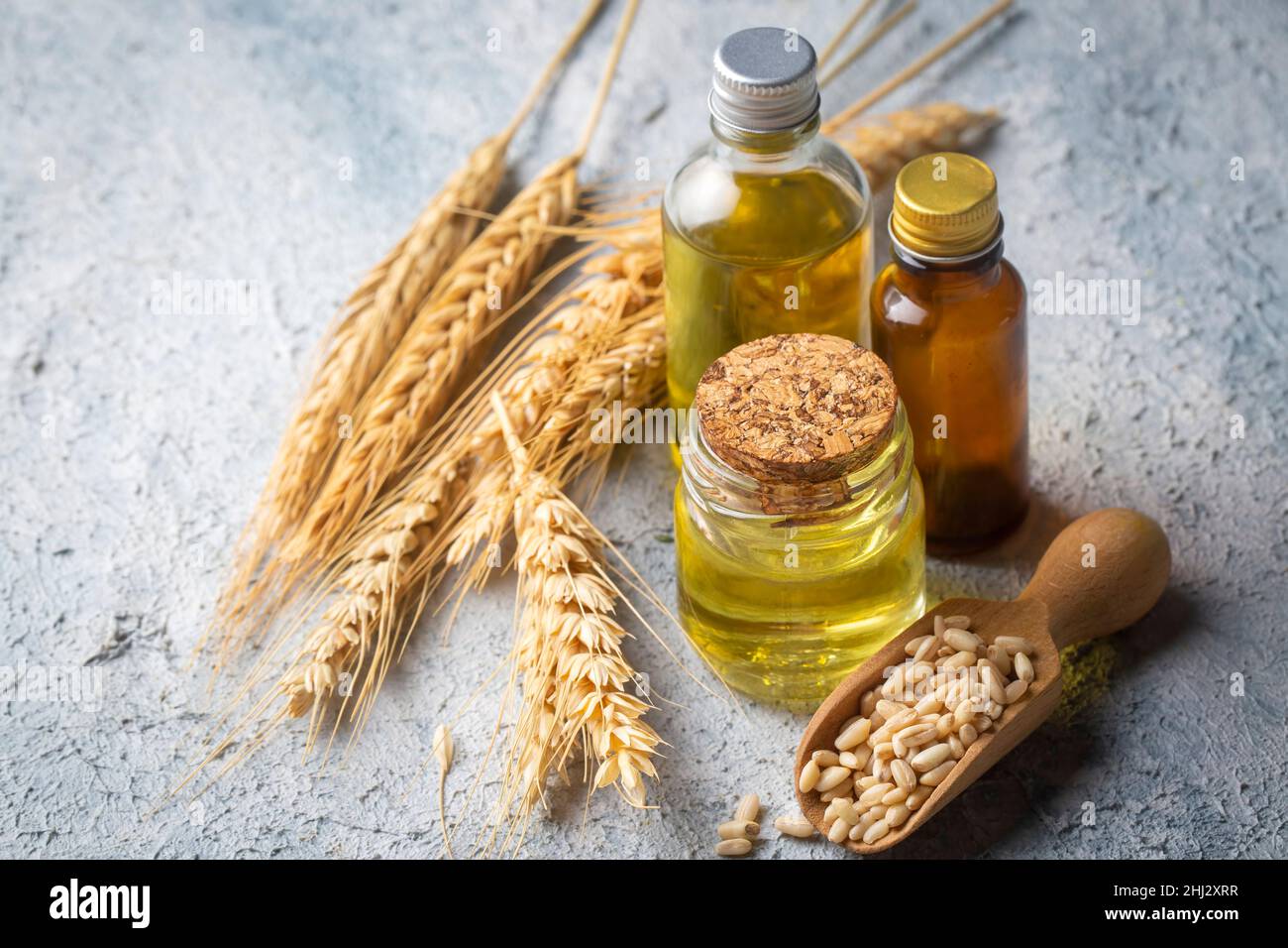 Wheat and wheat oil in bottles Stock Photo - Alamy