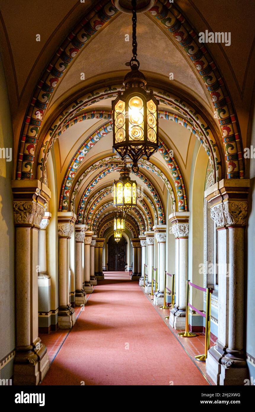 Vertical shot of the hallway with pointed arches inside the New Swan ...