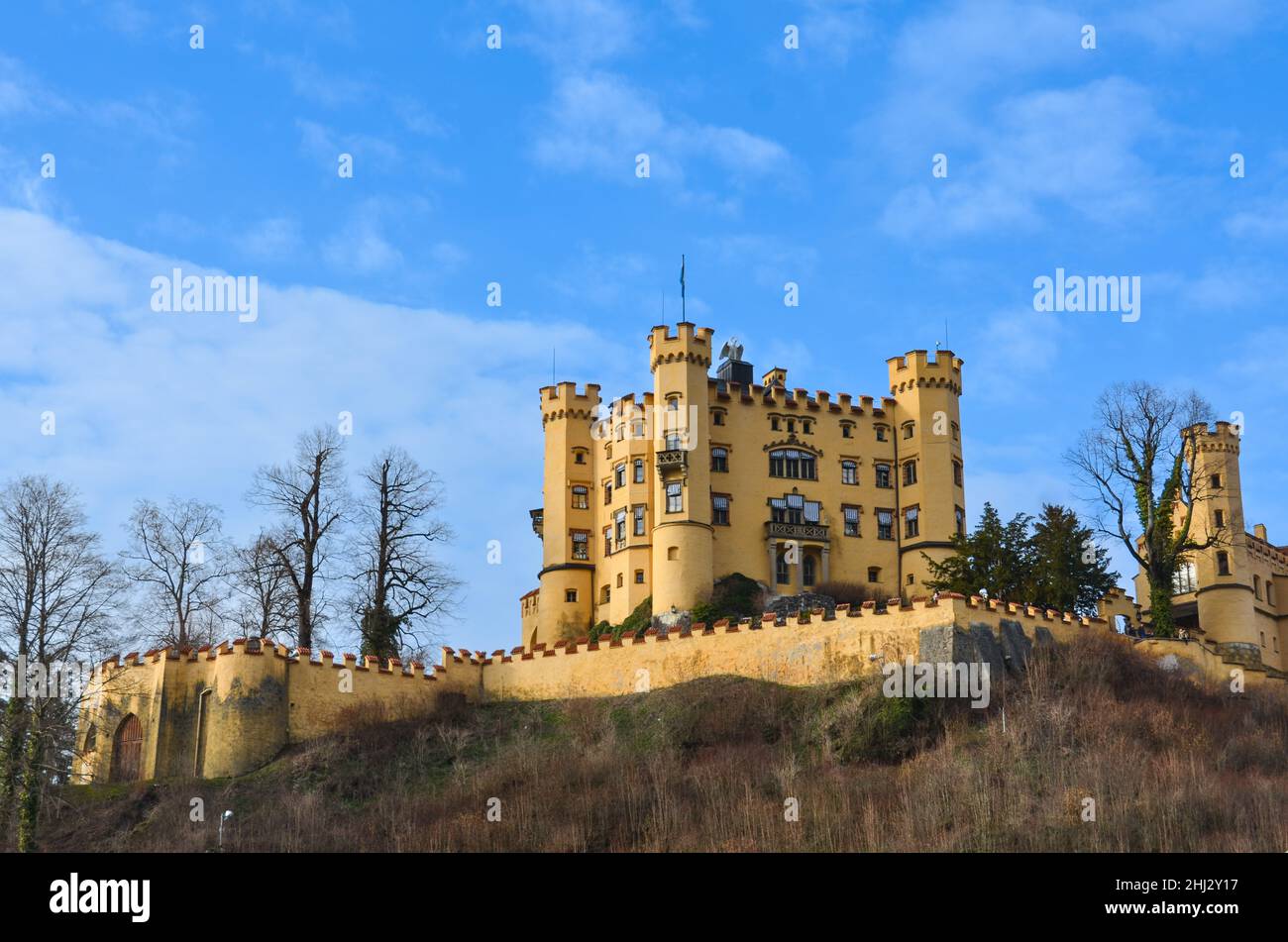 Yellow historic Hohenschwangau Castle under the German Alps, Schwangau ...
