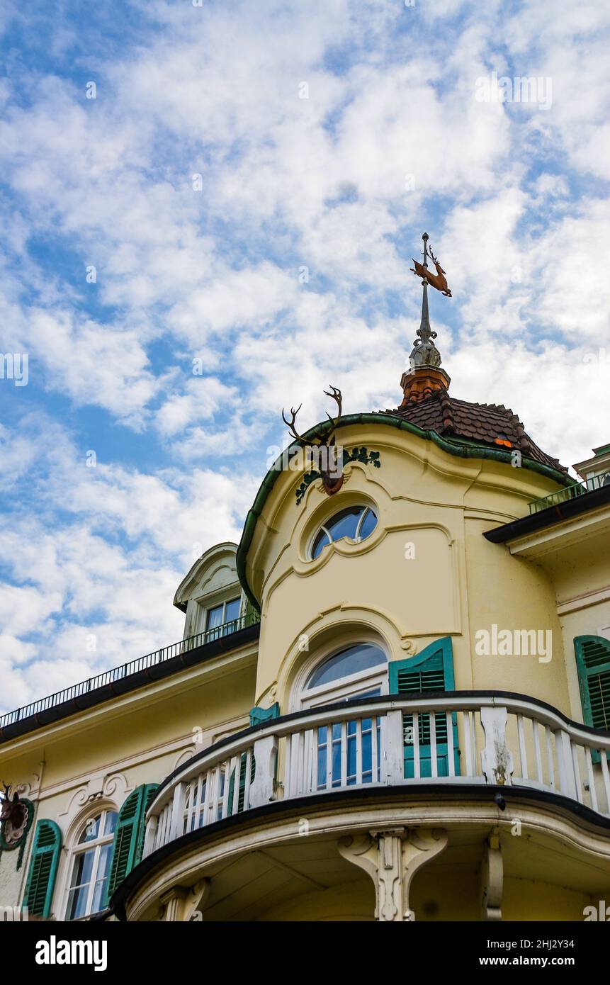 Vertical shot of a yellow historic castle under the German Alps Stock ...