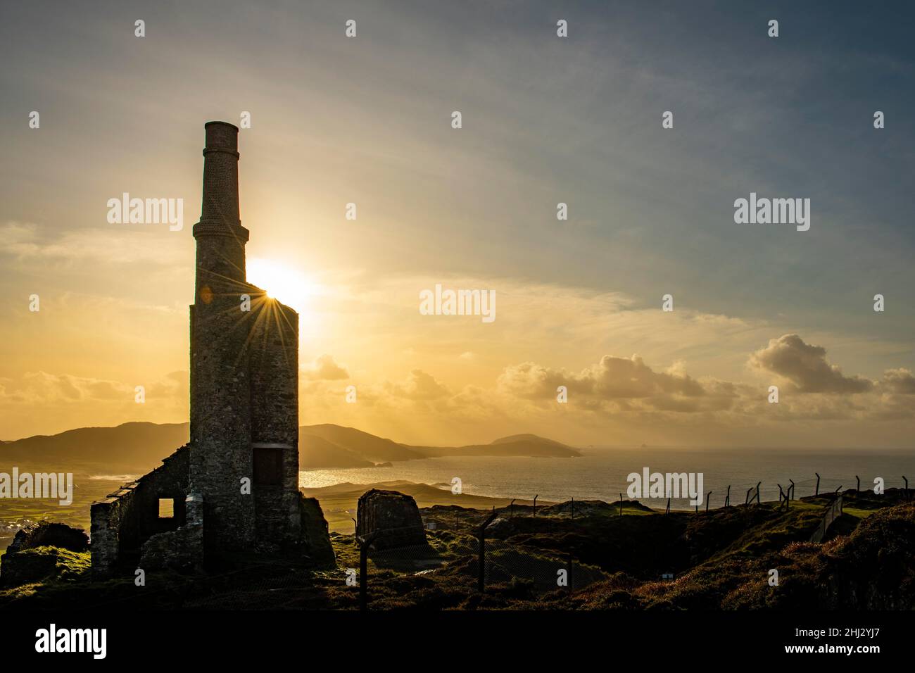 Old industrial plant backlit at golden hour, Beara Peninsula, Ireland ...