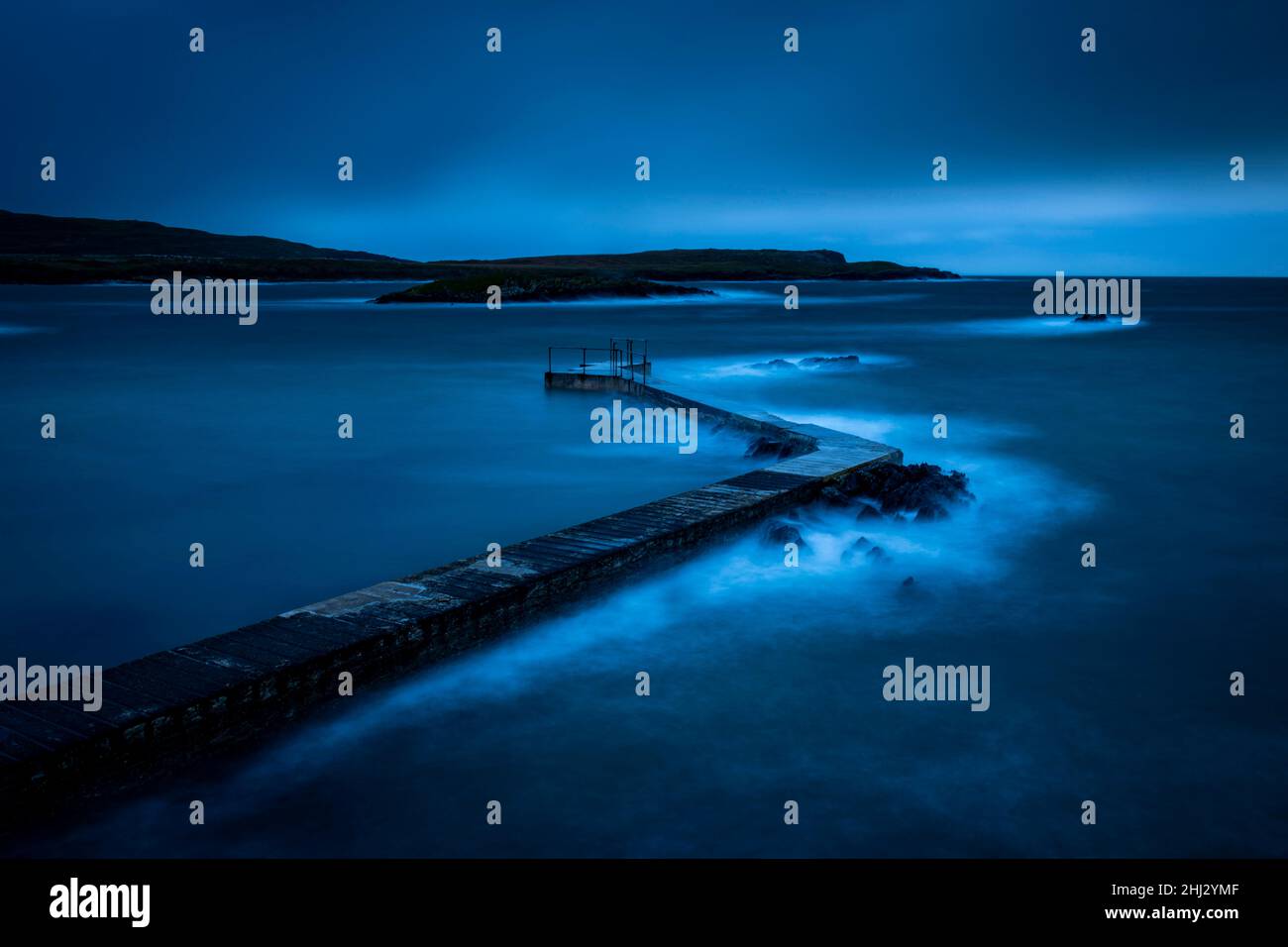 Sea surf on concrete jetty at blue hour, Beara Peninsula, Ireland Stock ...