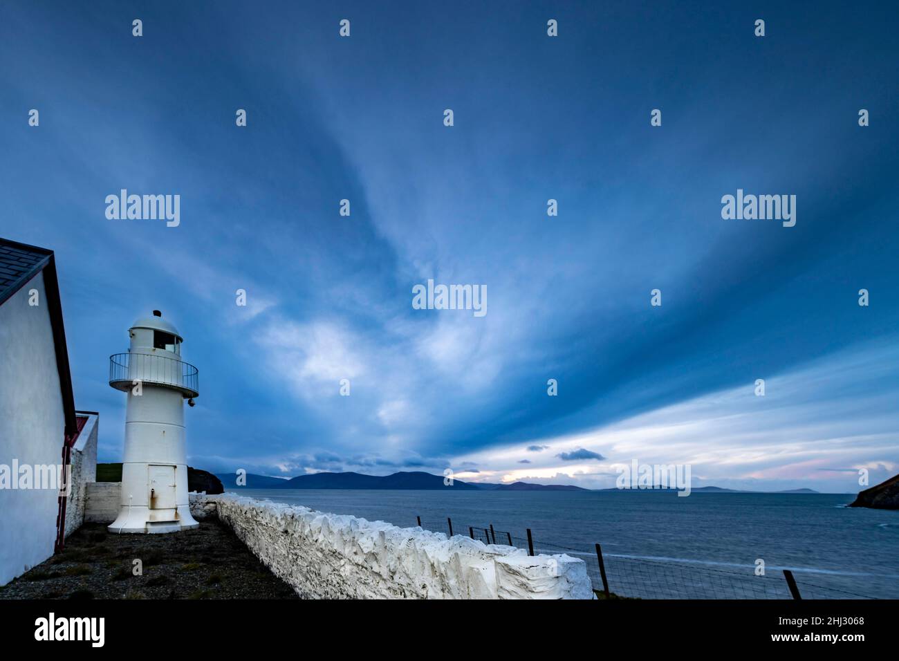Small lighthouse on the North Atlantic at blue hour, Dingle Peninsula ...