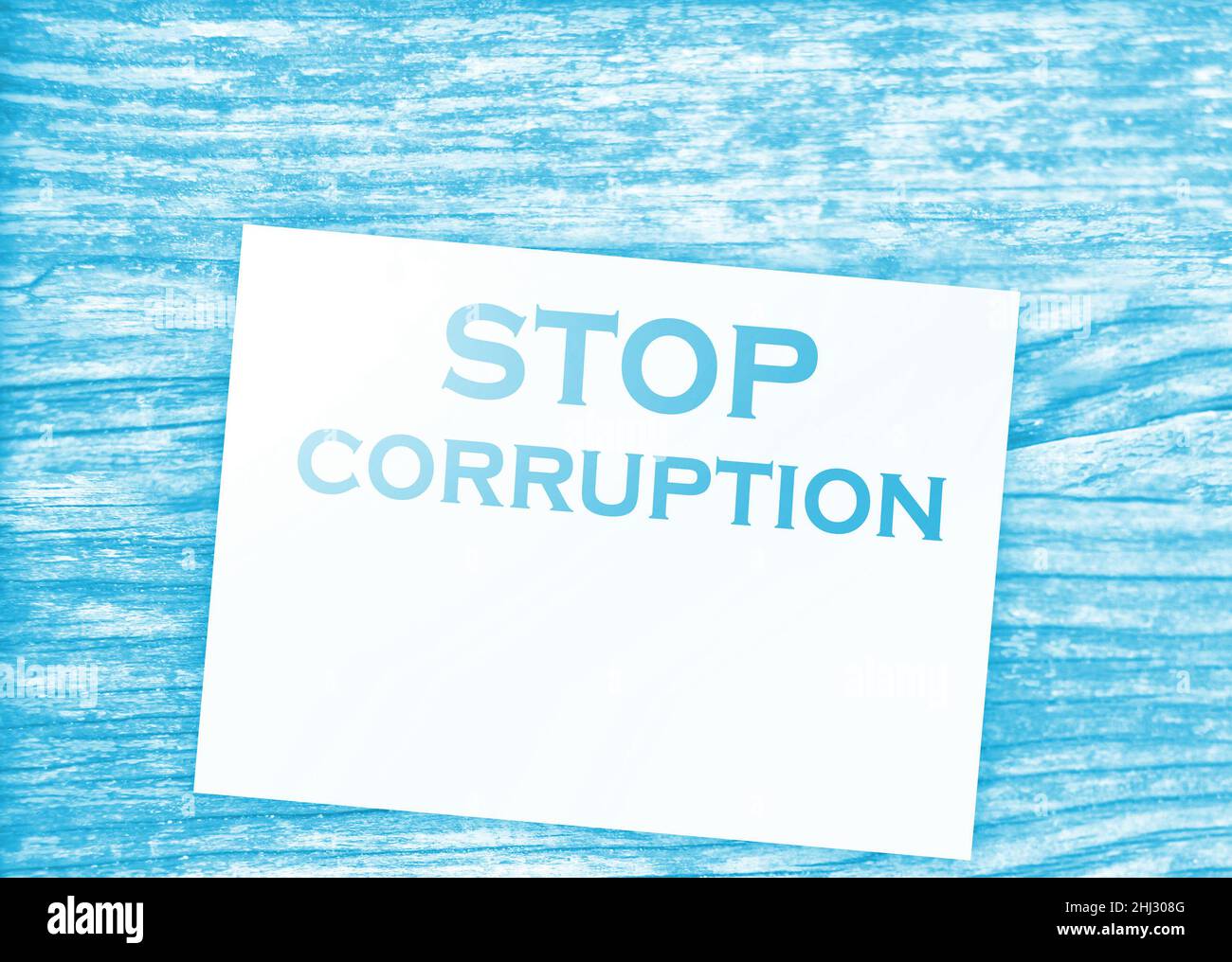 Stop Corruption Words on page and paper dollar signs around on wooden ...