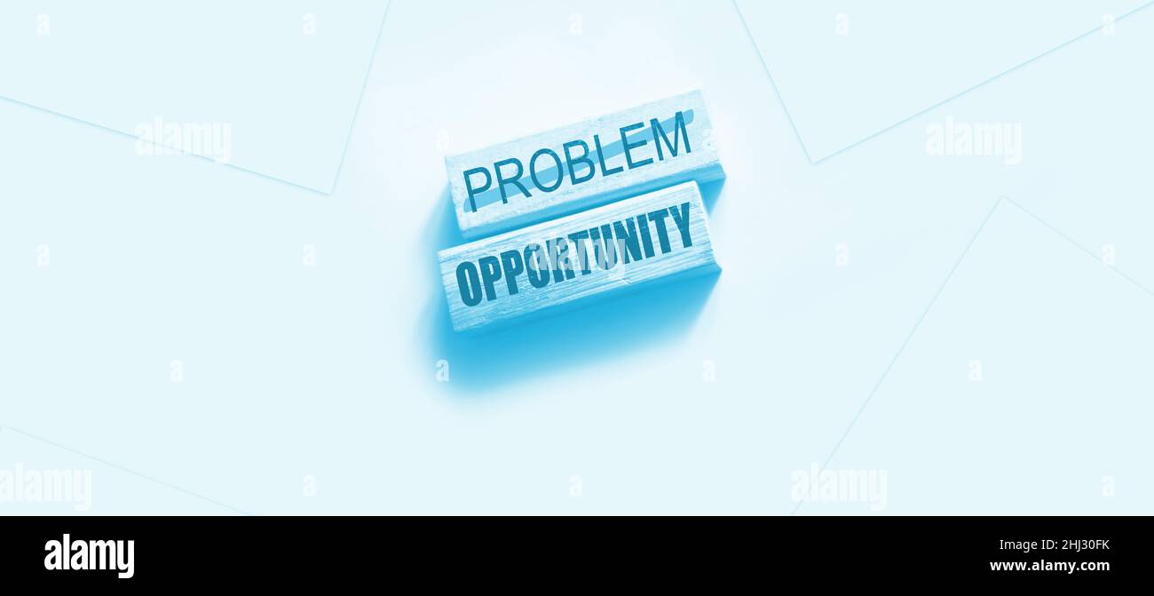 Problem crossed out and opportunity on wooden blocks. Business startup ...