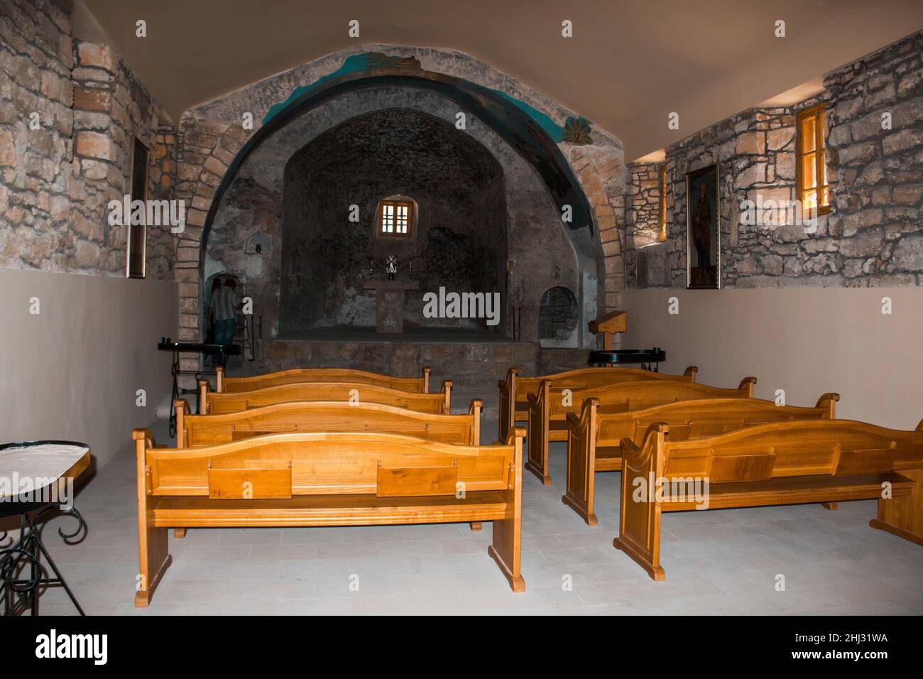 Old church inside. Wooden benches and stone walls Stock Photo - Alamy