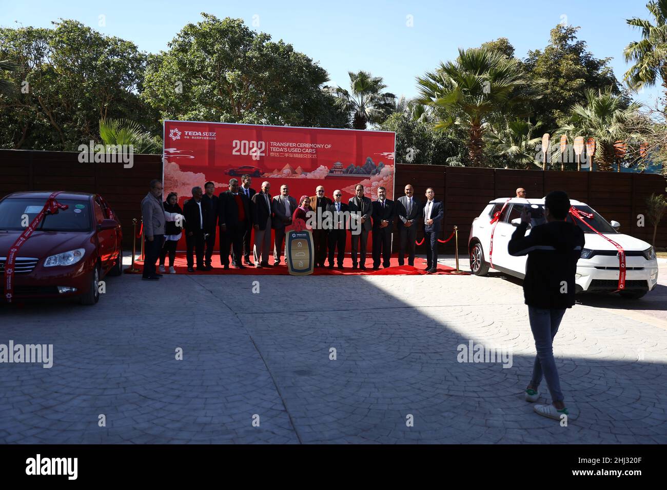 Suez, Egypt. 26th Jan, 2022. People attend a used-car transfer ceremony ...