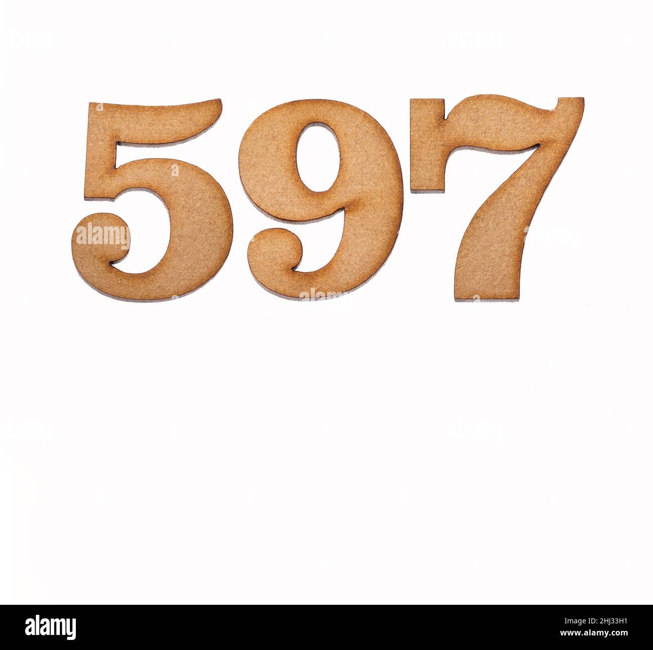 Number 597 in wood, isolated on white background Stock Photo - Alamy