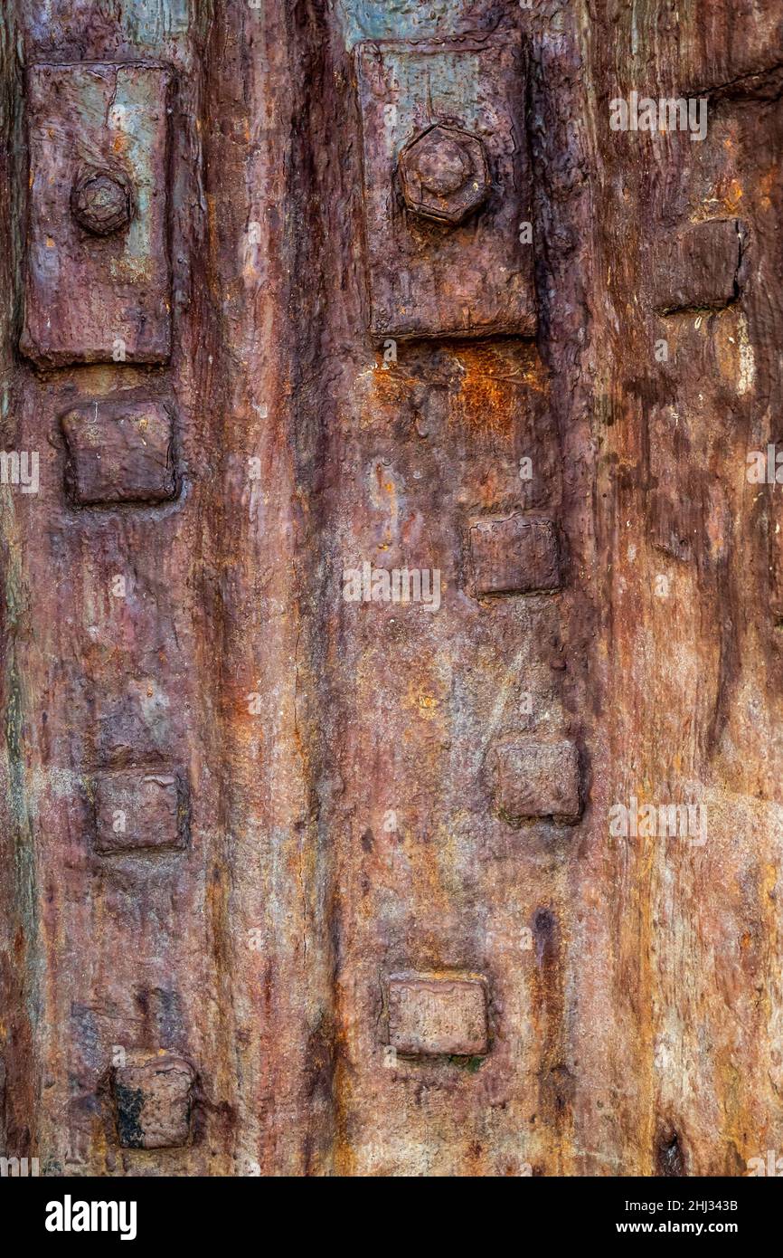 BACKGROUND TEXTURE - Old Rusty cast iron plate with bolts Stock Photo ...