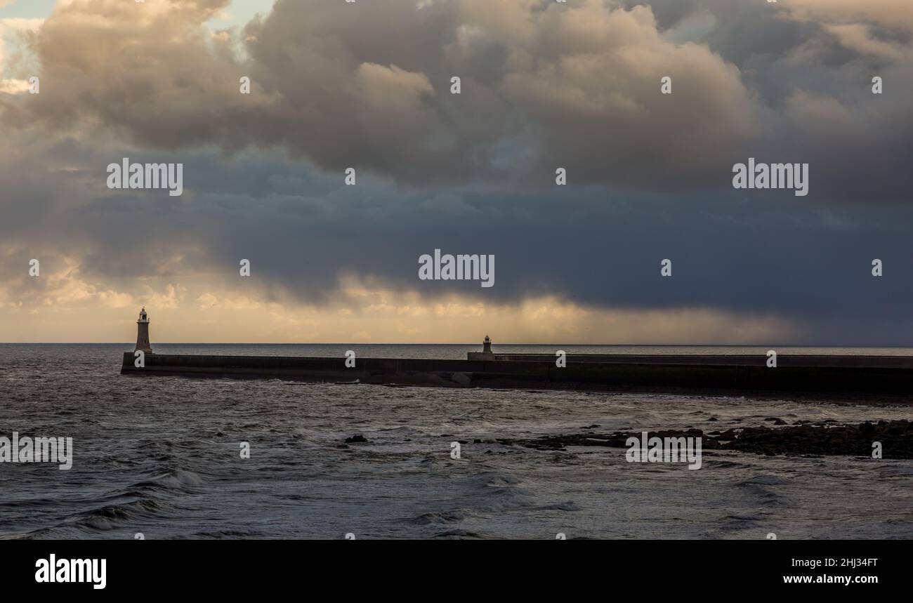 Rain clouds hang overhead the Piers at the mouth of the Tyne in ...
