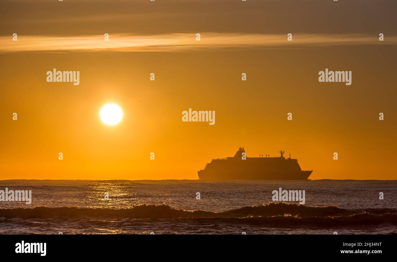 Sunrise on Tynemouth's Longsands beach as a passenger ferry heads ...