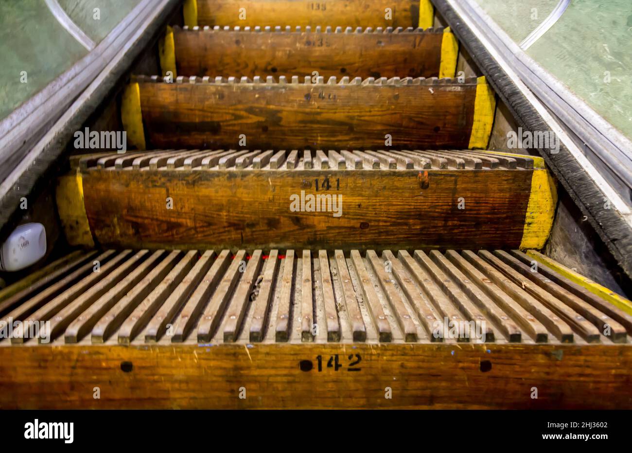 Old, wooden, numbered Escalator steps Stock Photo - Alamy