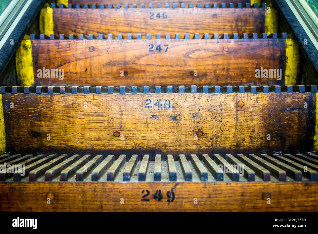 Old, wooden, numbered Escalator steps Stock Photo - Alamy