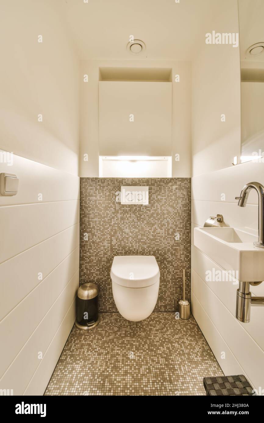 Interior of small clean restroom in miniature style Stock Photo - Alamy