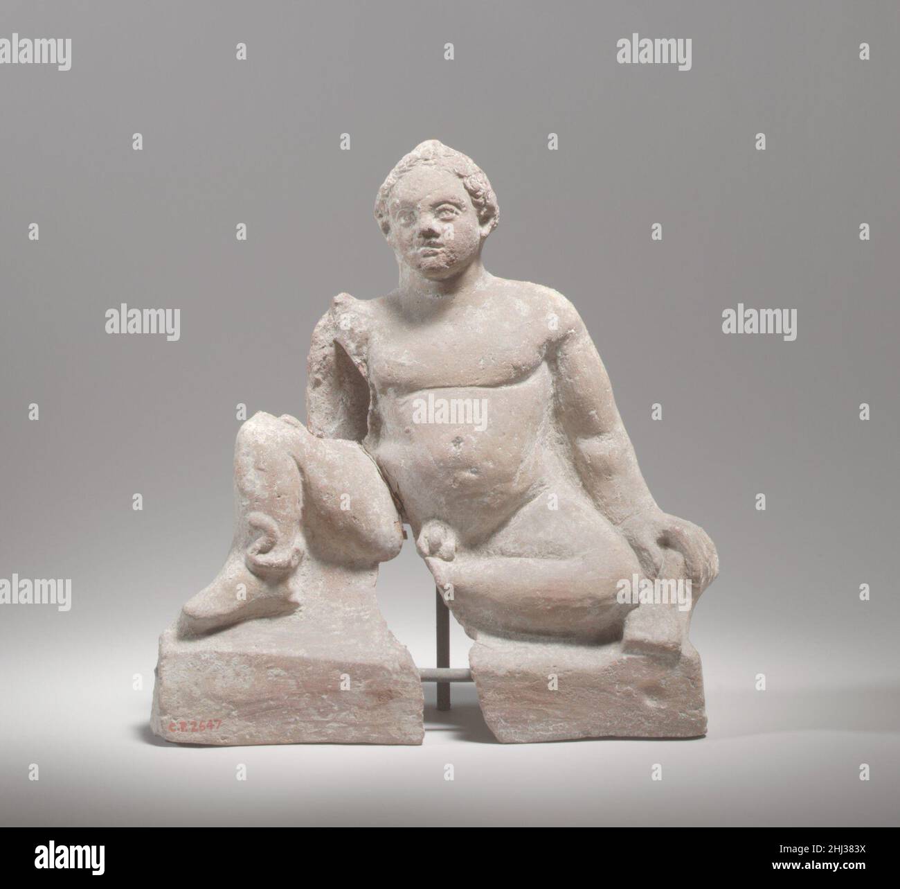 Seated boy 4th century B.C. Cypriot The figurine, of "temple boy" type ...