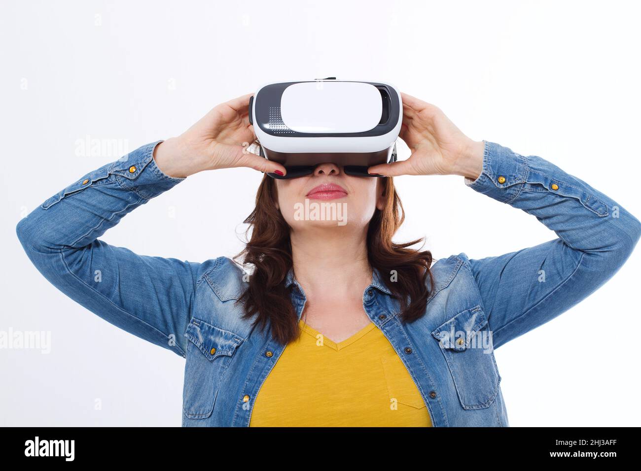 Woman wearing VR headset and looking up in virtual reality isolate on ...