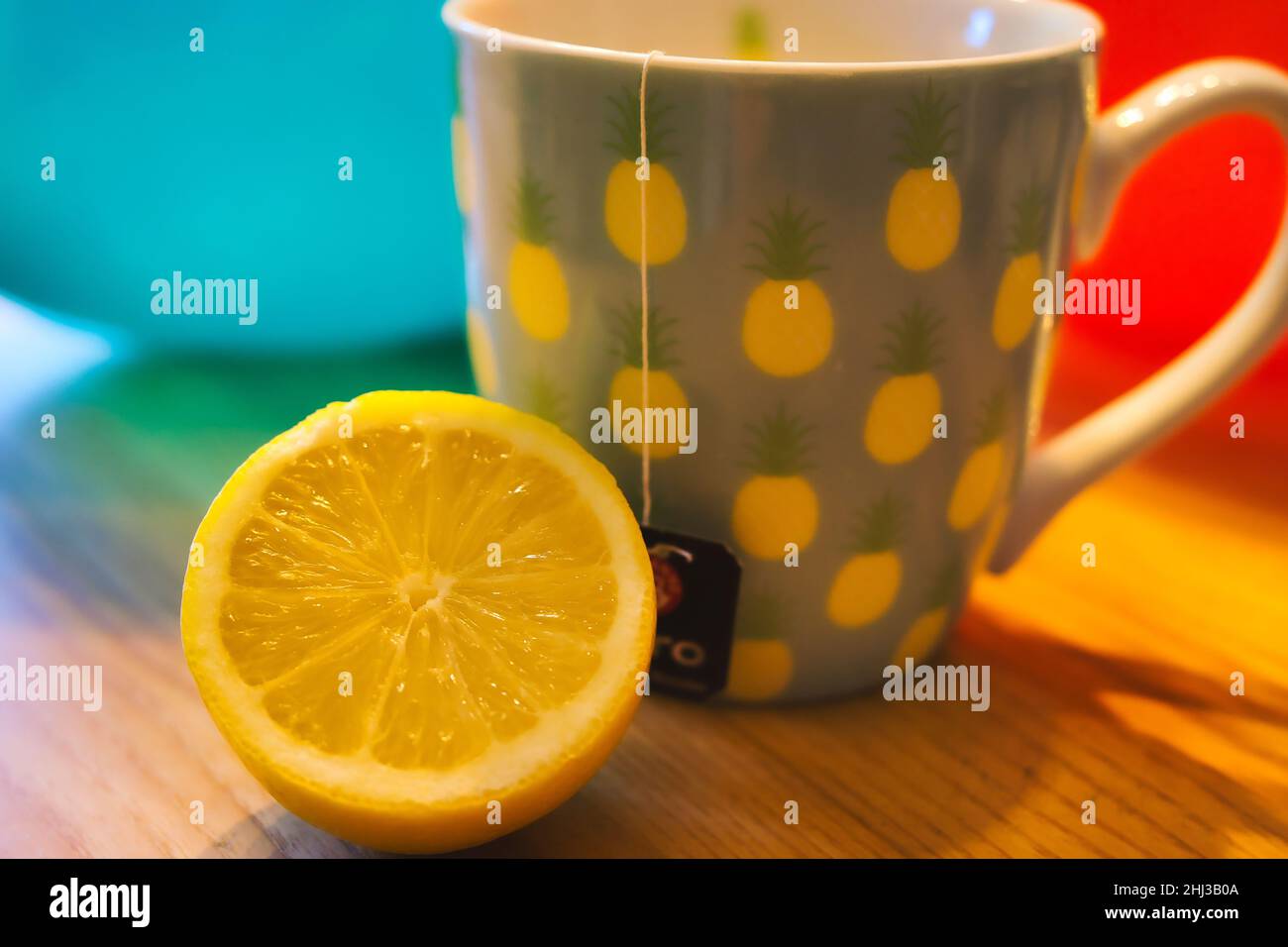 cut lemon in front of tea cup Stock Photo - Alamy