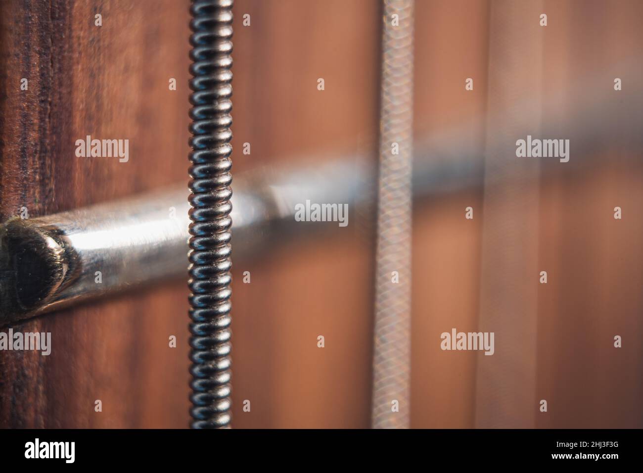 Macro photography of guitar strings and fret on fretboard Stock Photo ...