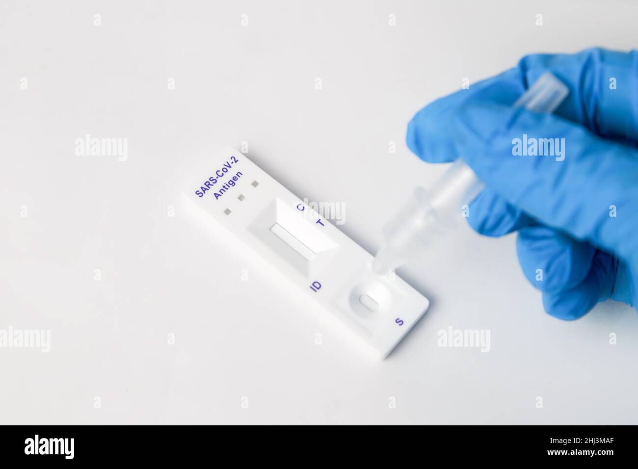 Man makes a covid-19 antigen pcr test macro. The test showed a positive ...