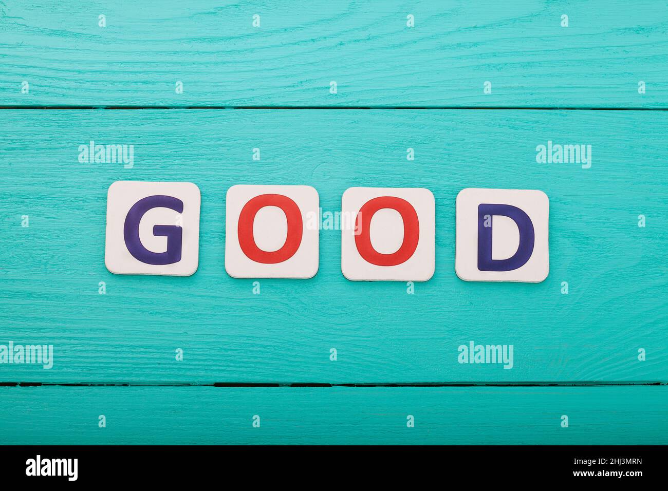 Word good on blue wooden background. Copy space. Top view. Mock up ...