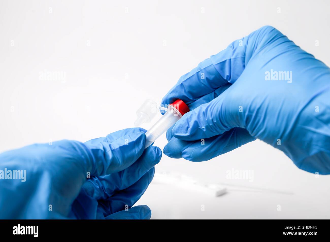 Man makes a covid-19 antigen pcr test macro. The test showed a positive ...