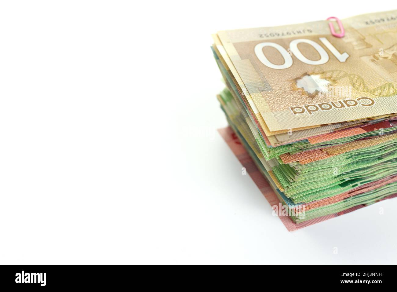 High Angle View of Large Stack of Canadian Banknotes on a White ...