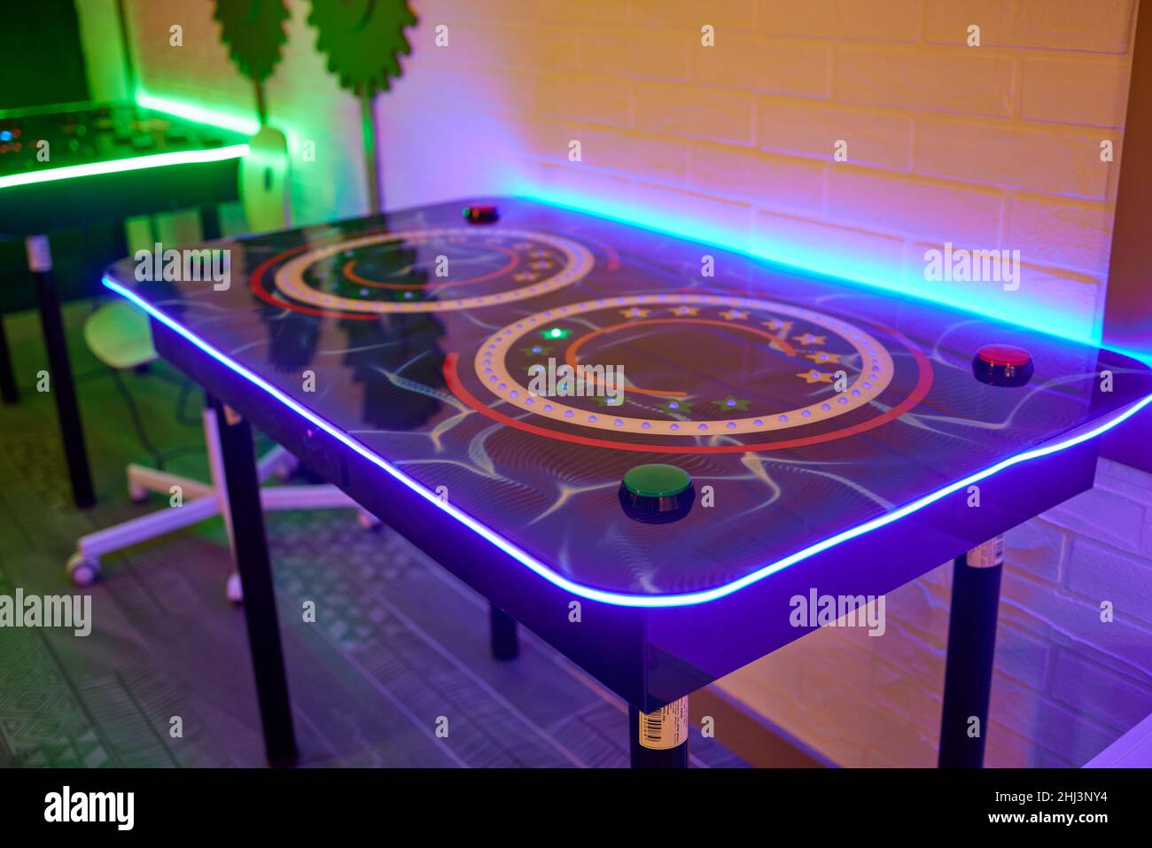 Joystick and button controls of a vintage arcade video game in a dark ...