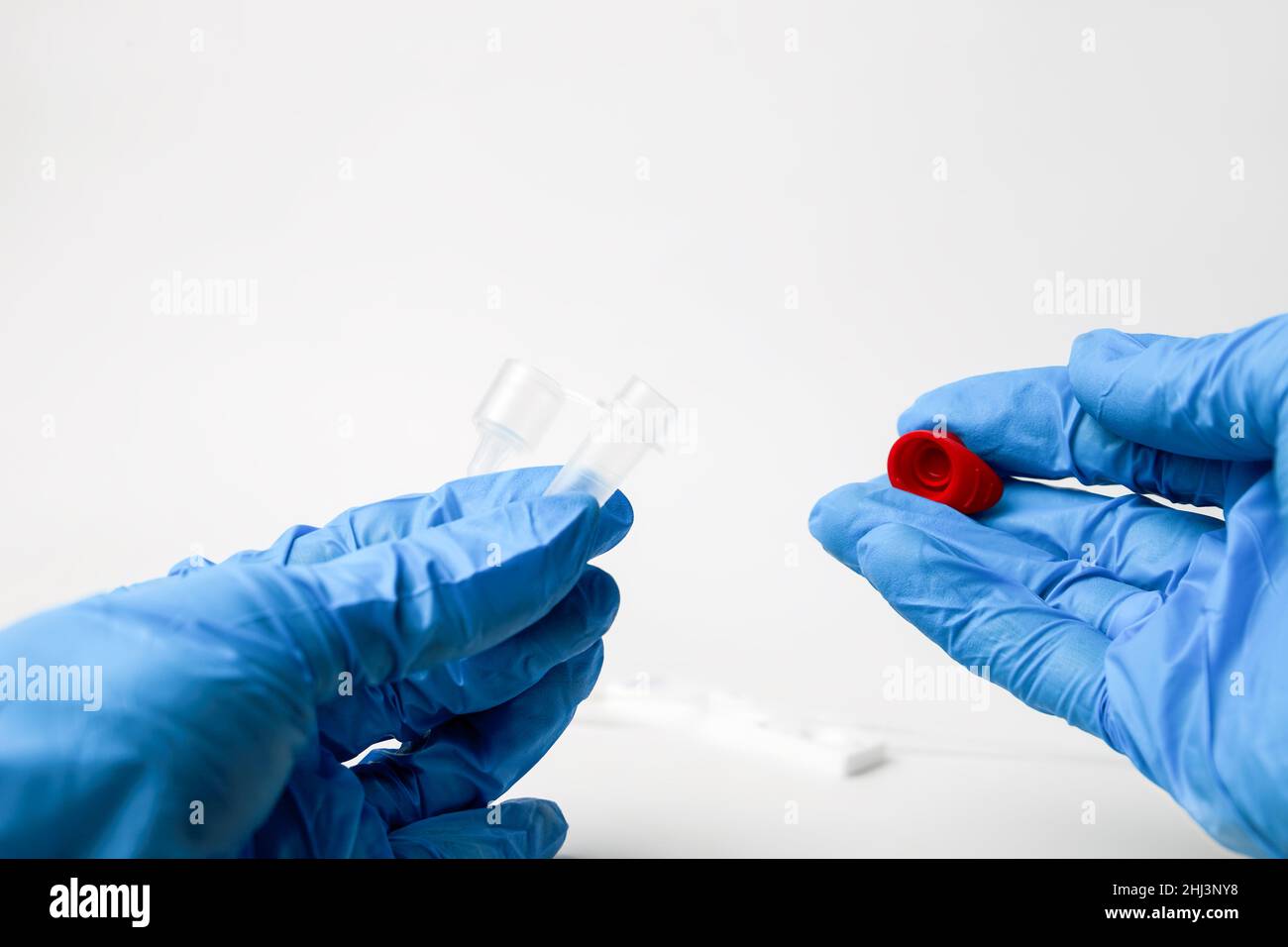 Man makes a covid-19 antigen pcr test macro. The test showed a positive ...