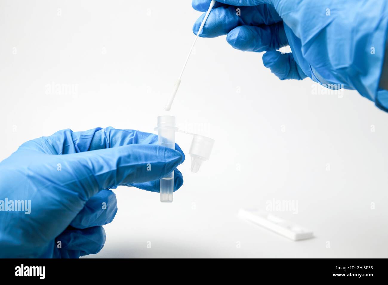 Man makes a covid-19 antigen pcr test macro. The test showed a positive ...