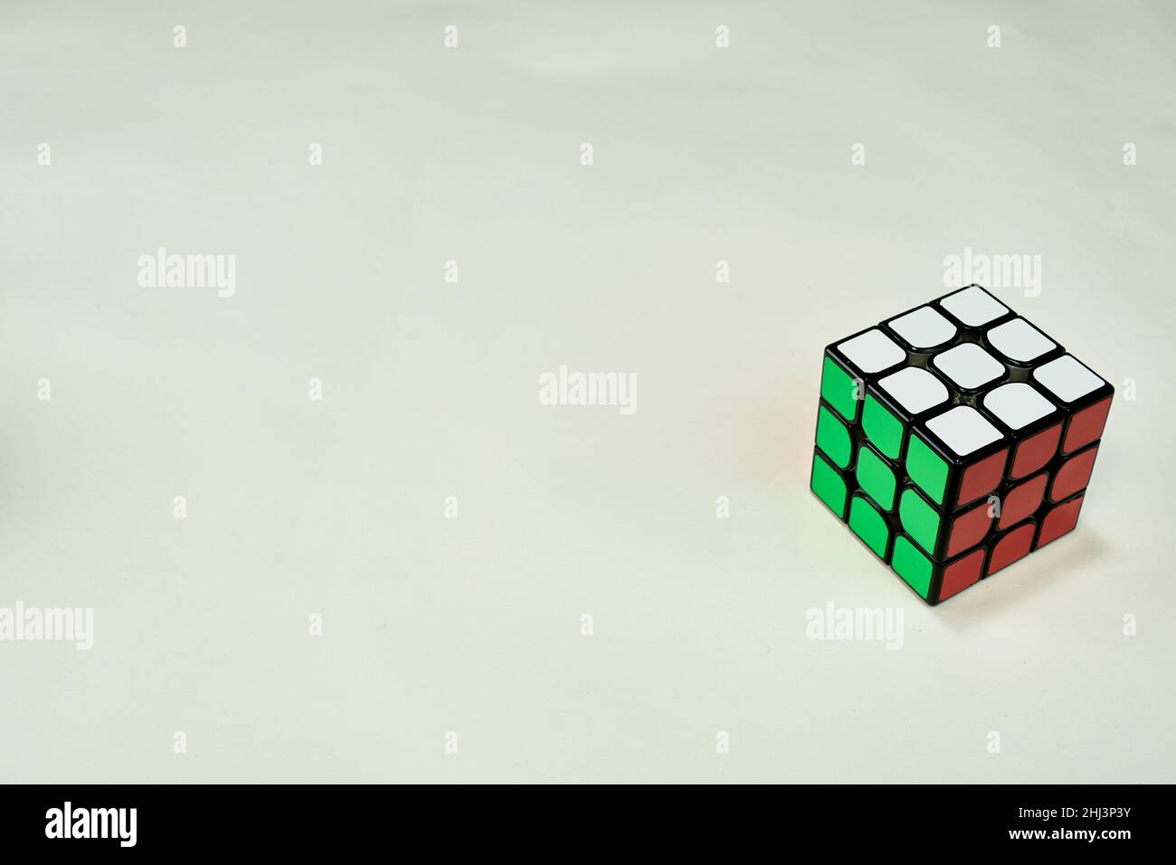 solved rubik's cube in white, green and red on white background with ... solved rubik's cube in white, green and red on white background with ...