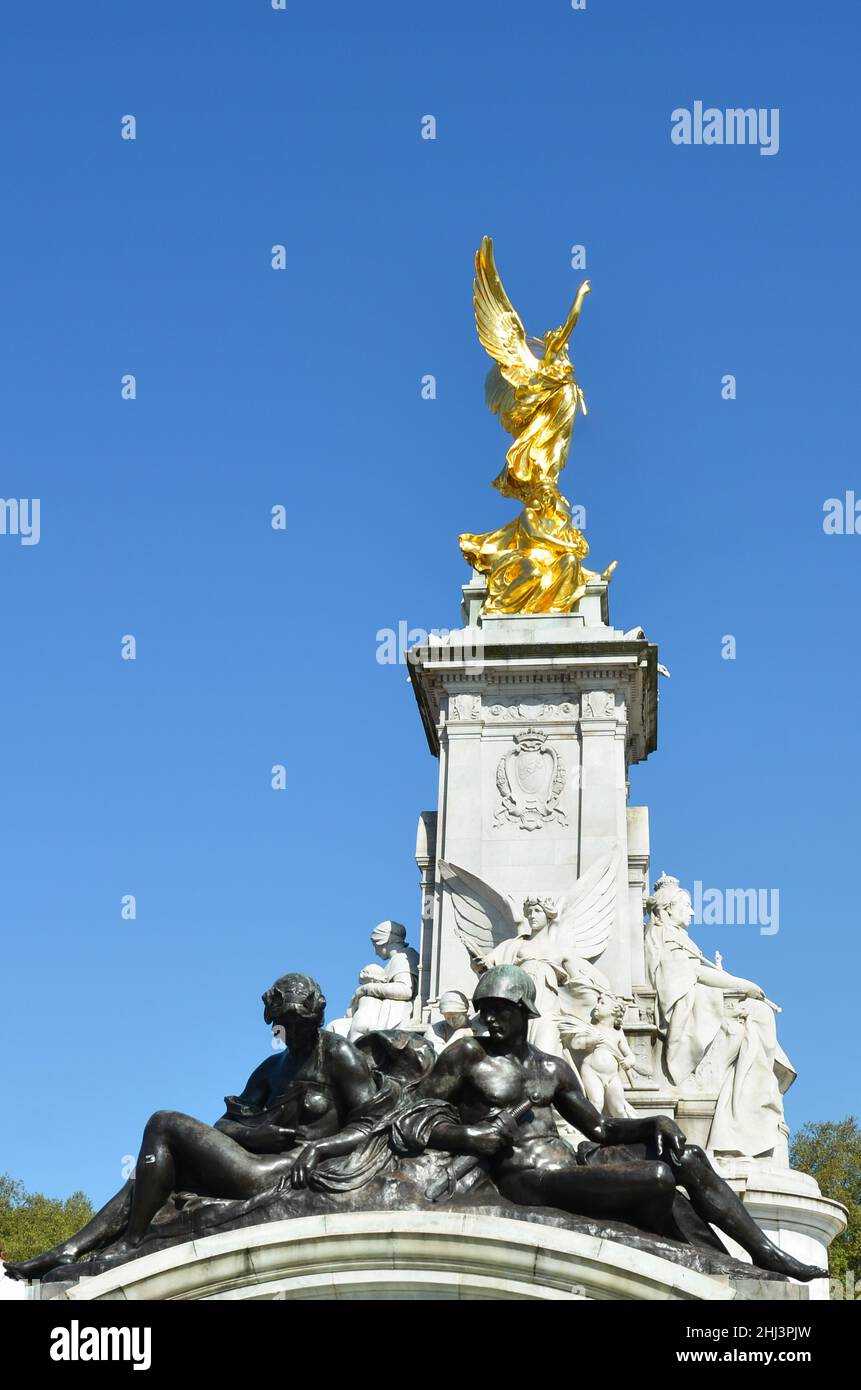 Vertical shot of the Queen Victoria memorial statue in front of the ...