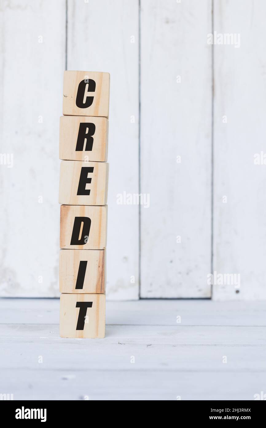 wooden cube, with the word credit, with white wooden background Stock ...