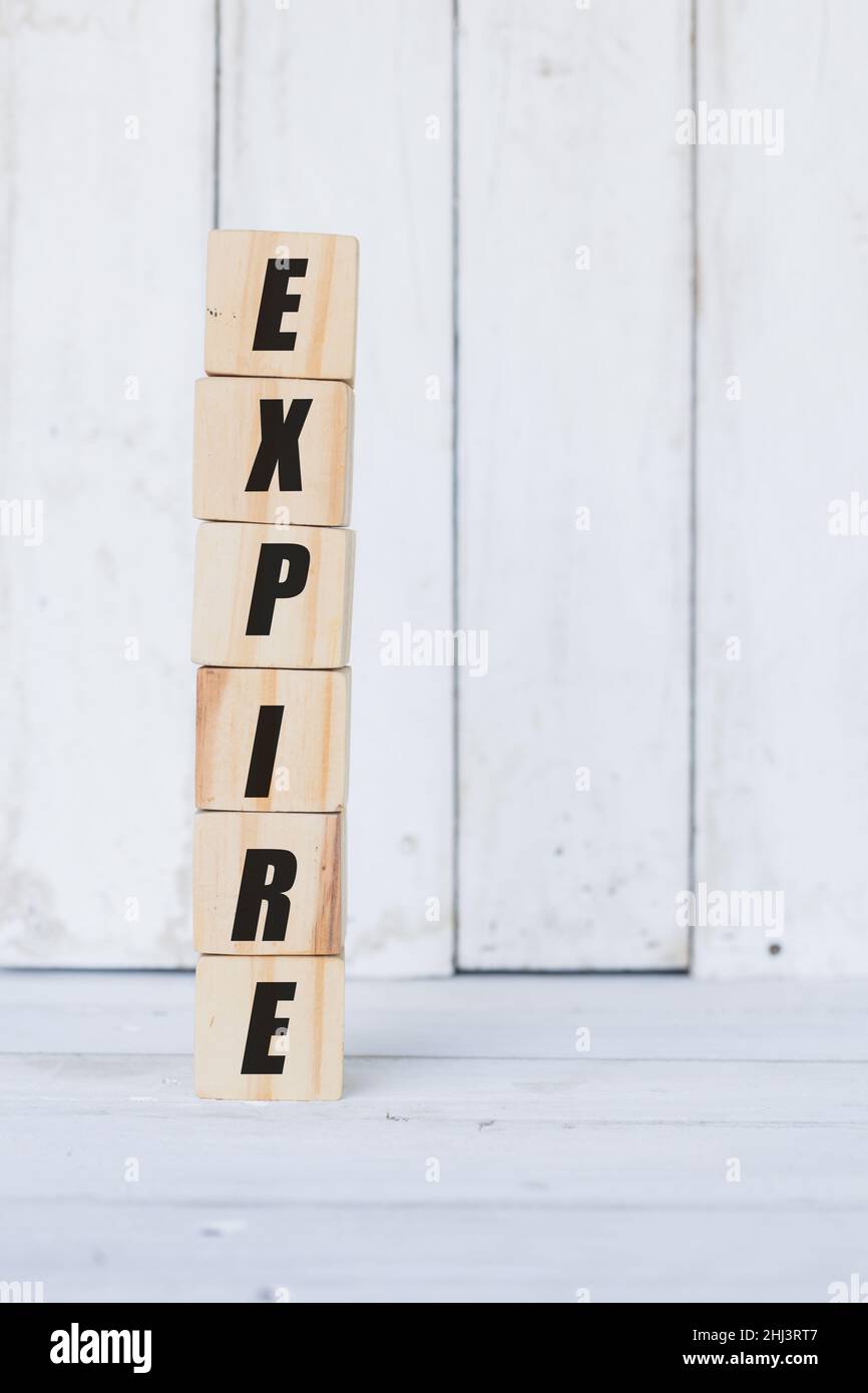 wooden cube, with the word expire, with white wooden background Stock ...