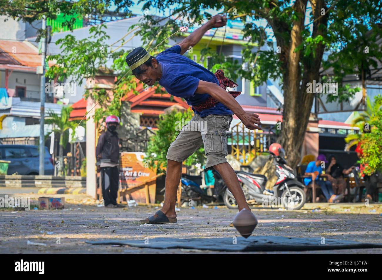 Belopa, Indonesia. 26th Jan, 2022. A man seen playing a traditional ...